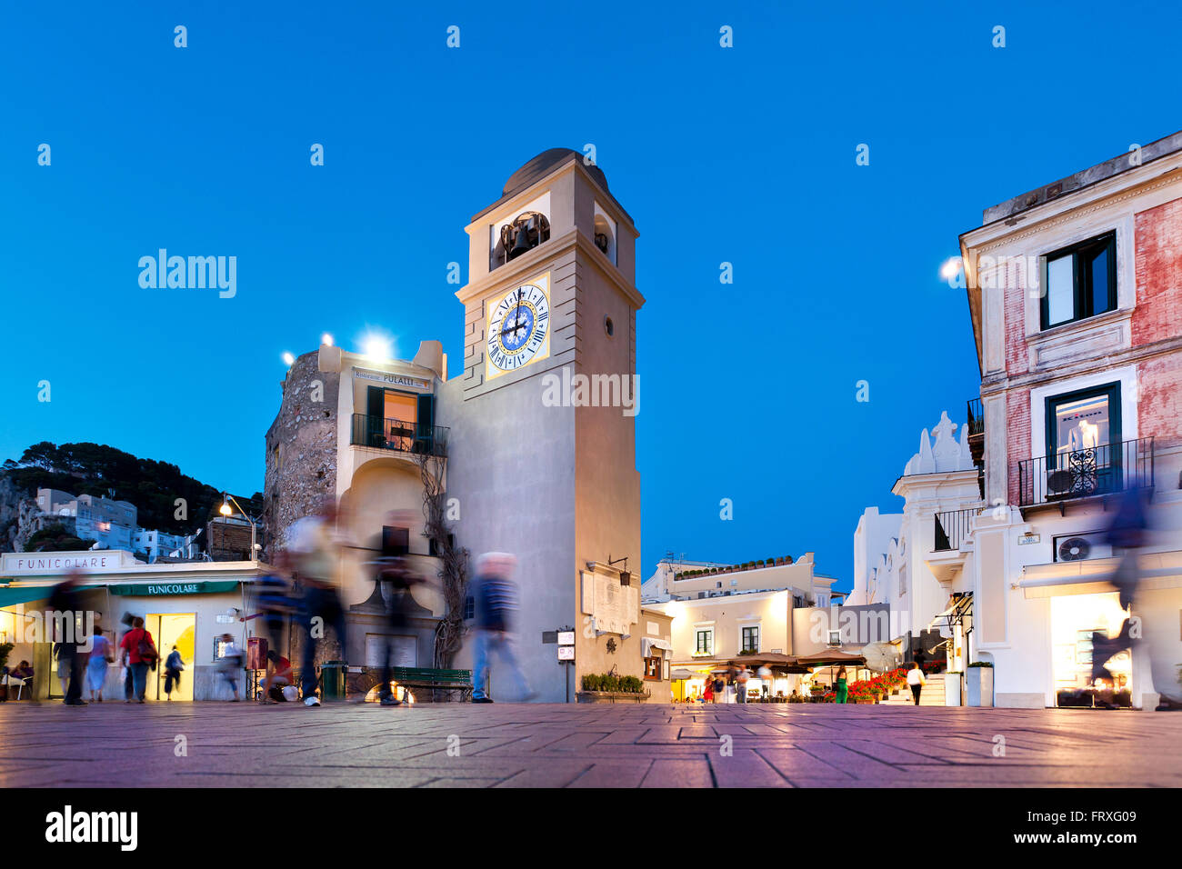 Clock tower on Piazza Umberto I in the evening light, Capri, Bay of ...