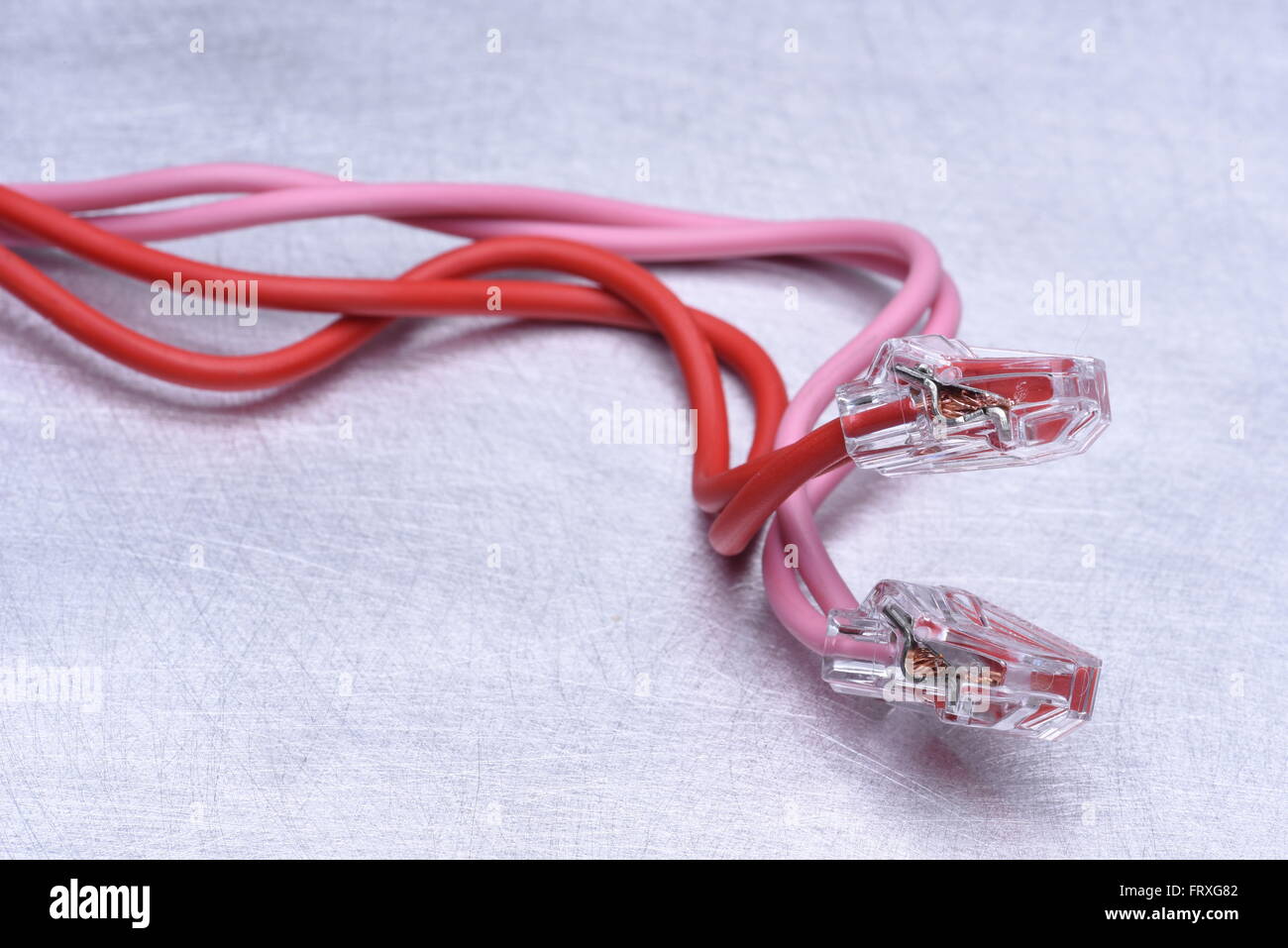 Closeup of a electric cables on metalic grey background Stock Photo - Alamy