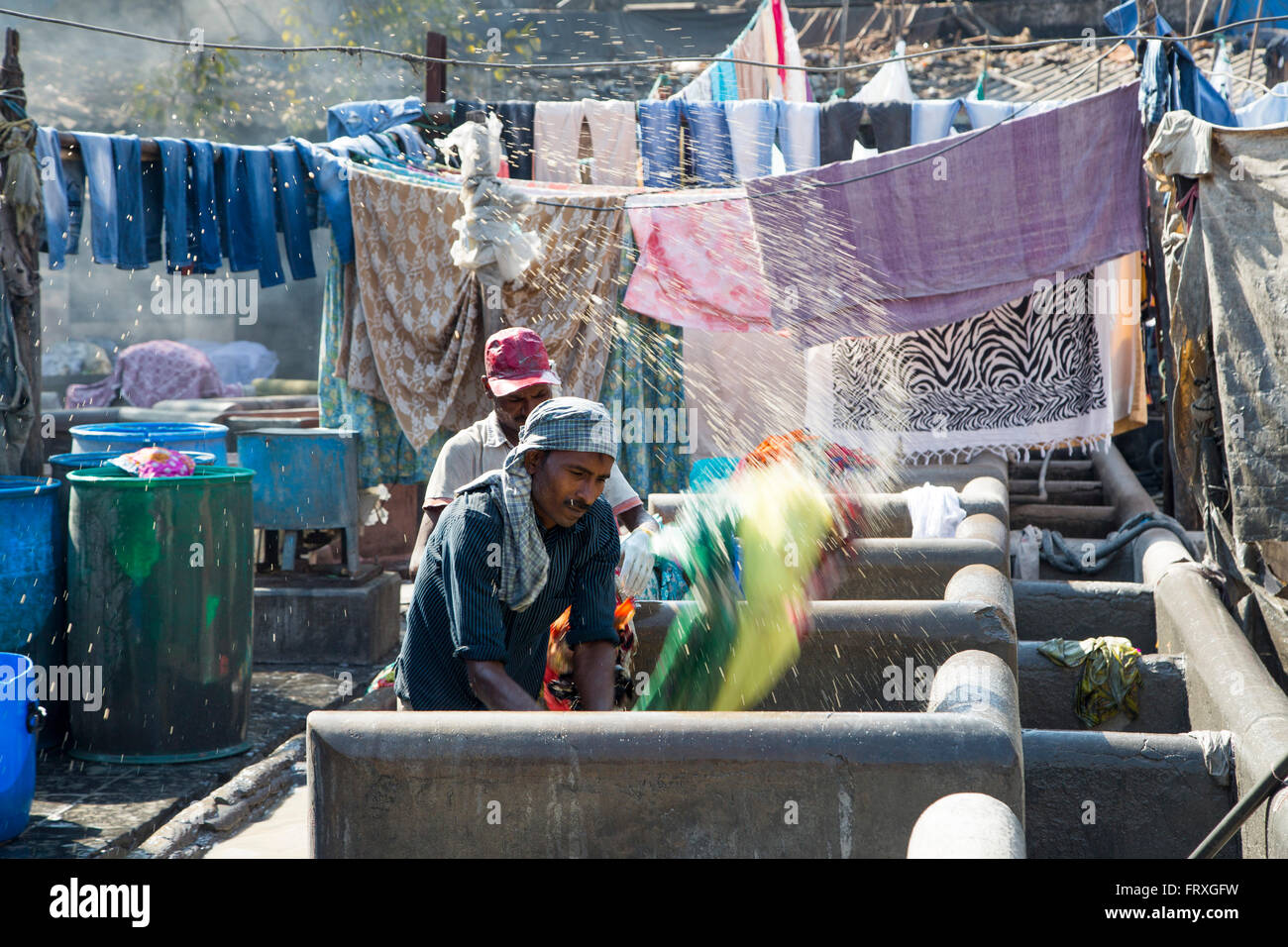 Men washing clothes at Mahalaxmi Dhobi Ghat open air laundromat, Mumbai ...