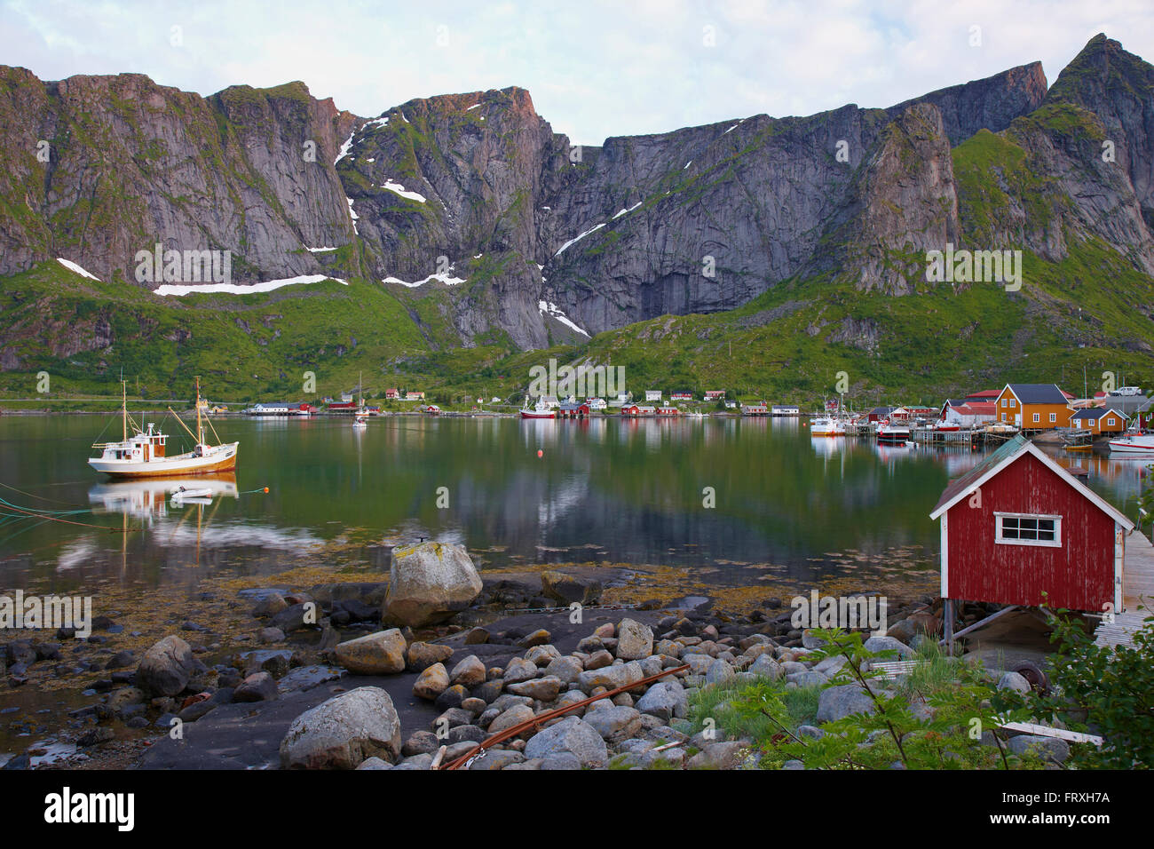 Rorbuer and old fishing boat in the village of Reine, Isle of Moskenes ...