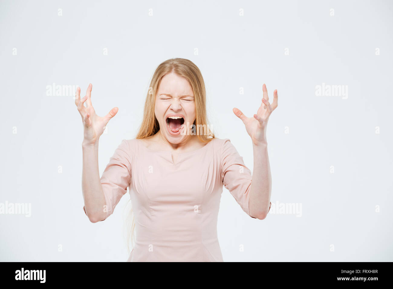 Angry woman screaming isolated on a white background Stock Photo - Alamy