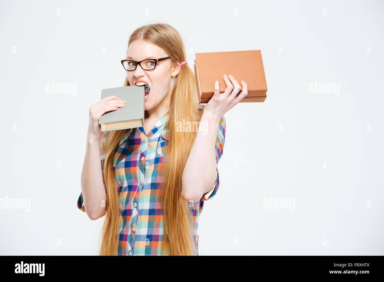 Female student biting book isolated on a white background Stock Photo ...