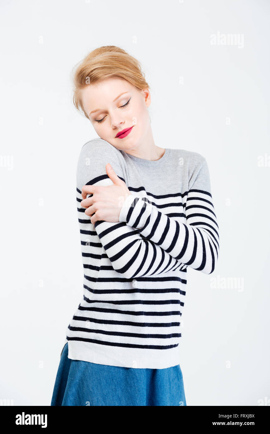 Relaxed woman with closed eyes standing isolated on a white background ...