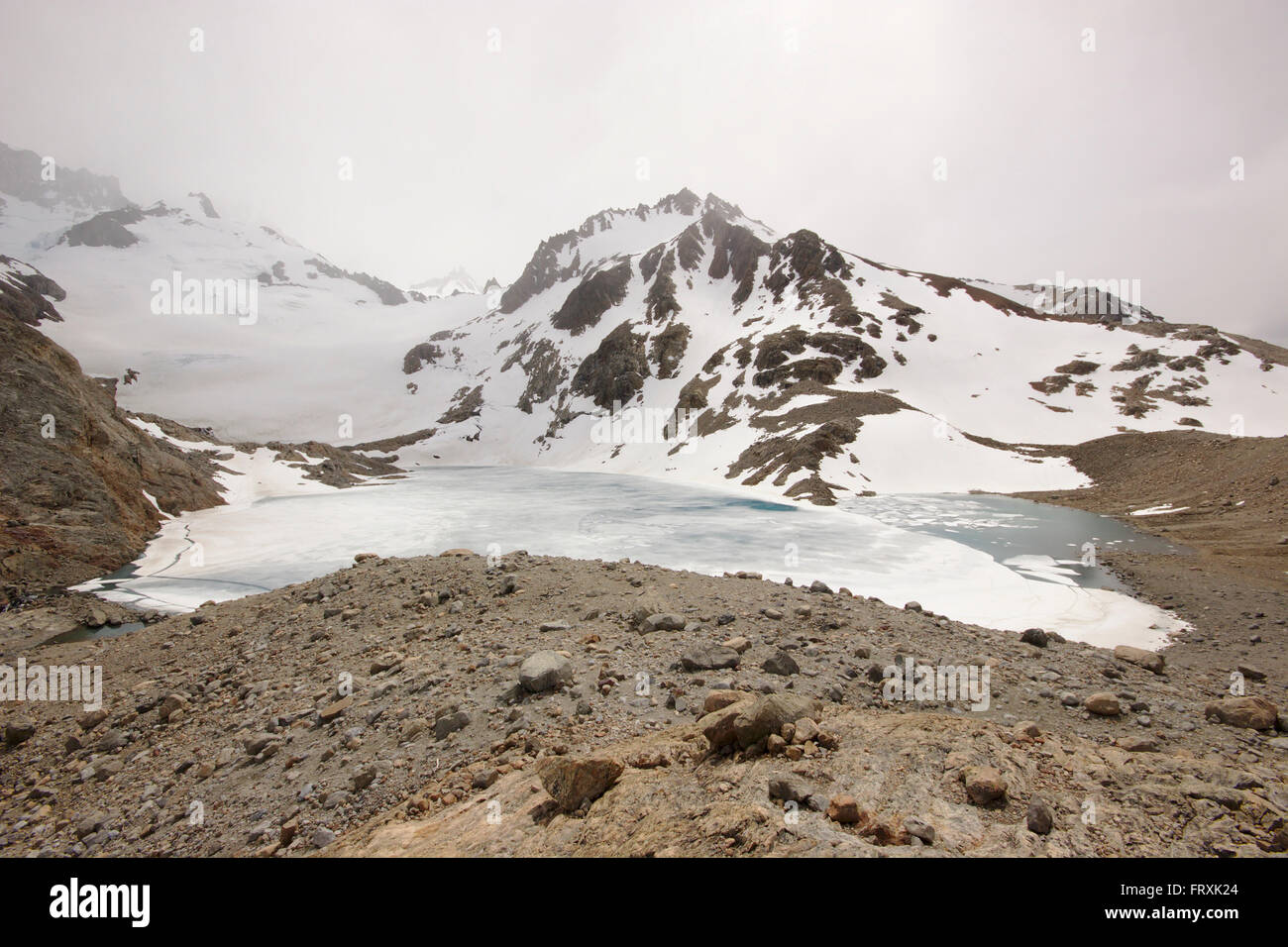 Frozen Laguna de Los Tres, mountain lake below Fitz Roy, Los Glaciares ...