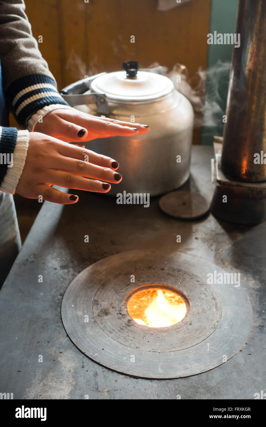 Warming Cold Hands. Photographed during winter in Qinghai, China Stock ...