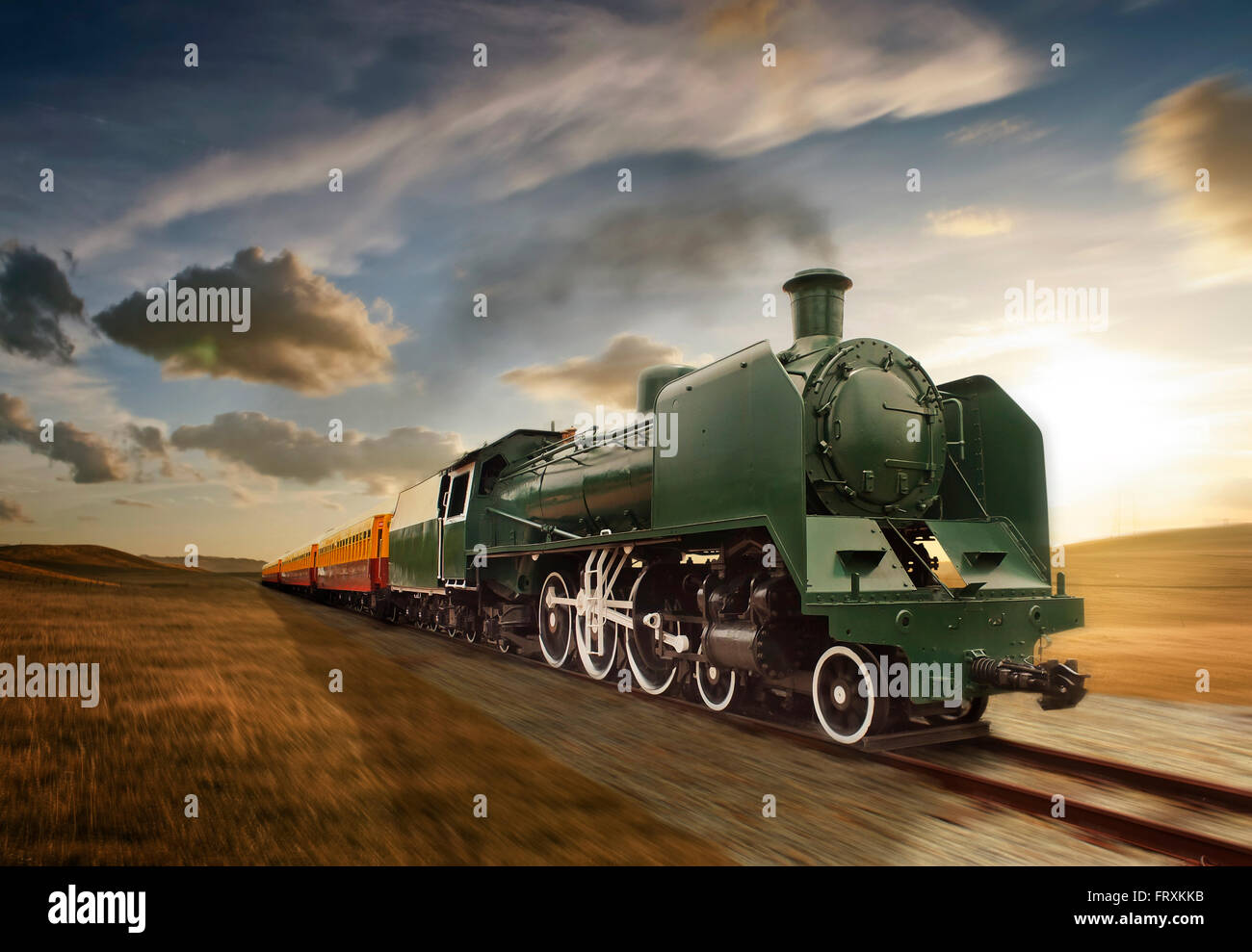 vintage green and yellow steam powered railway train moving Stock Photo ...