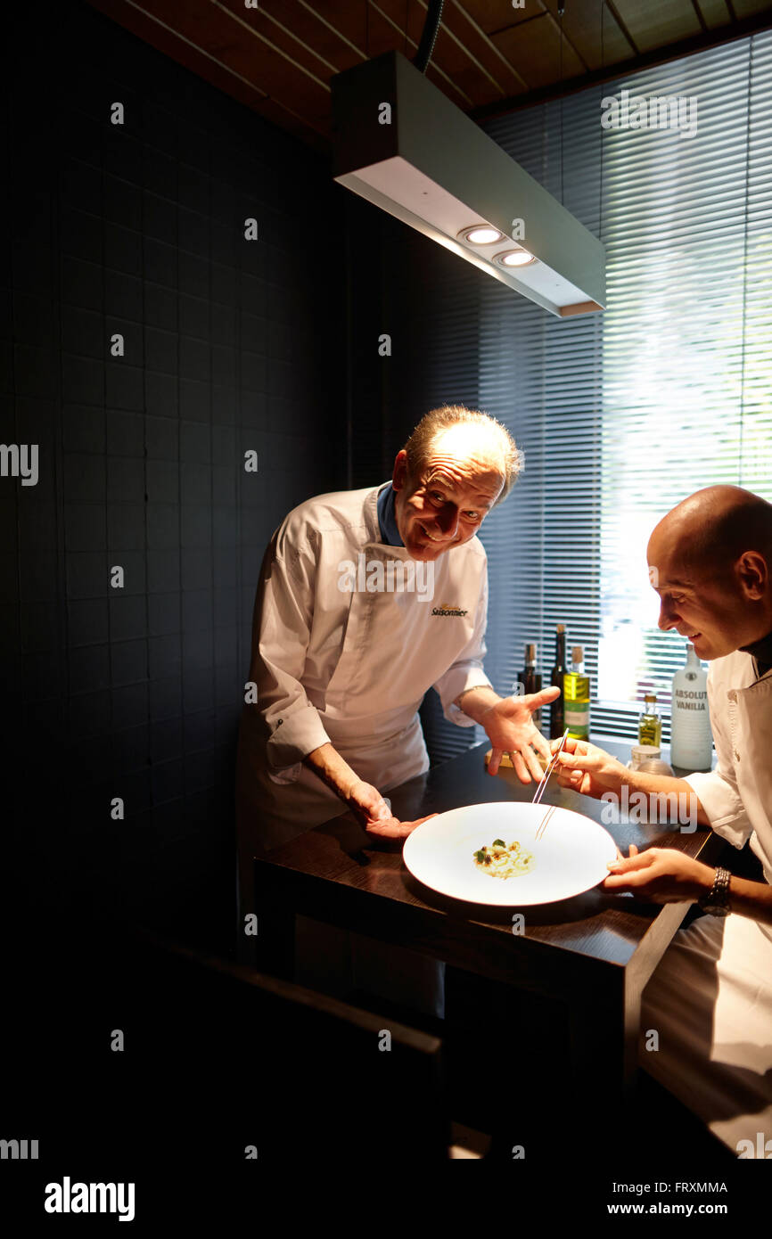 Chefs preparing marinated scallops with Enoki mushrooms, Angelik pearls ...