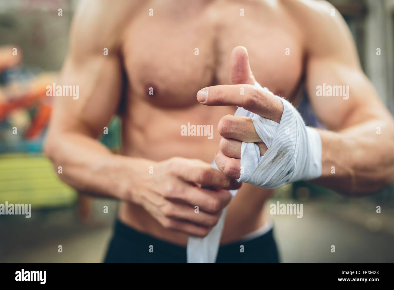 Boxer bandaging his hand Stock Photo - Alamy