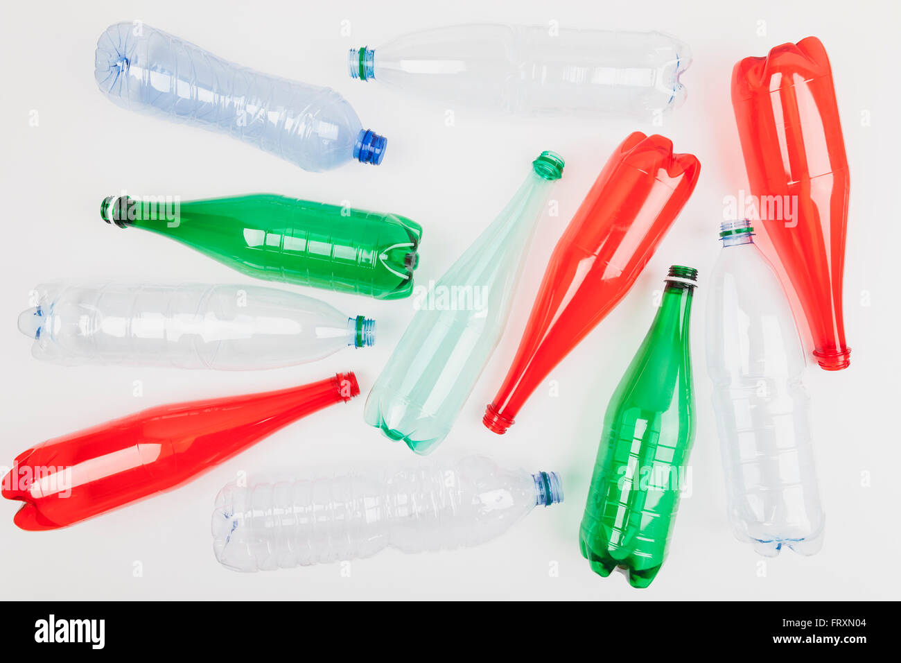 Different empty plastic bottles on white ground Stock Photo - Alamy