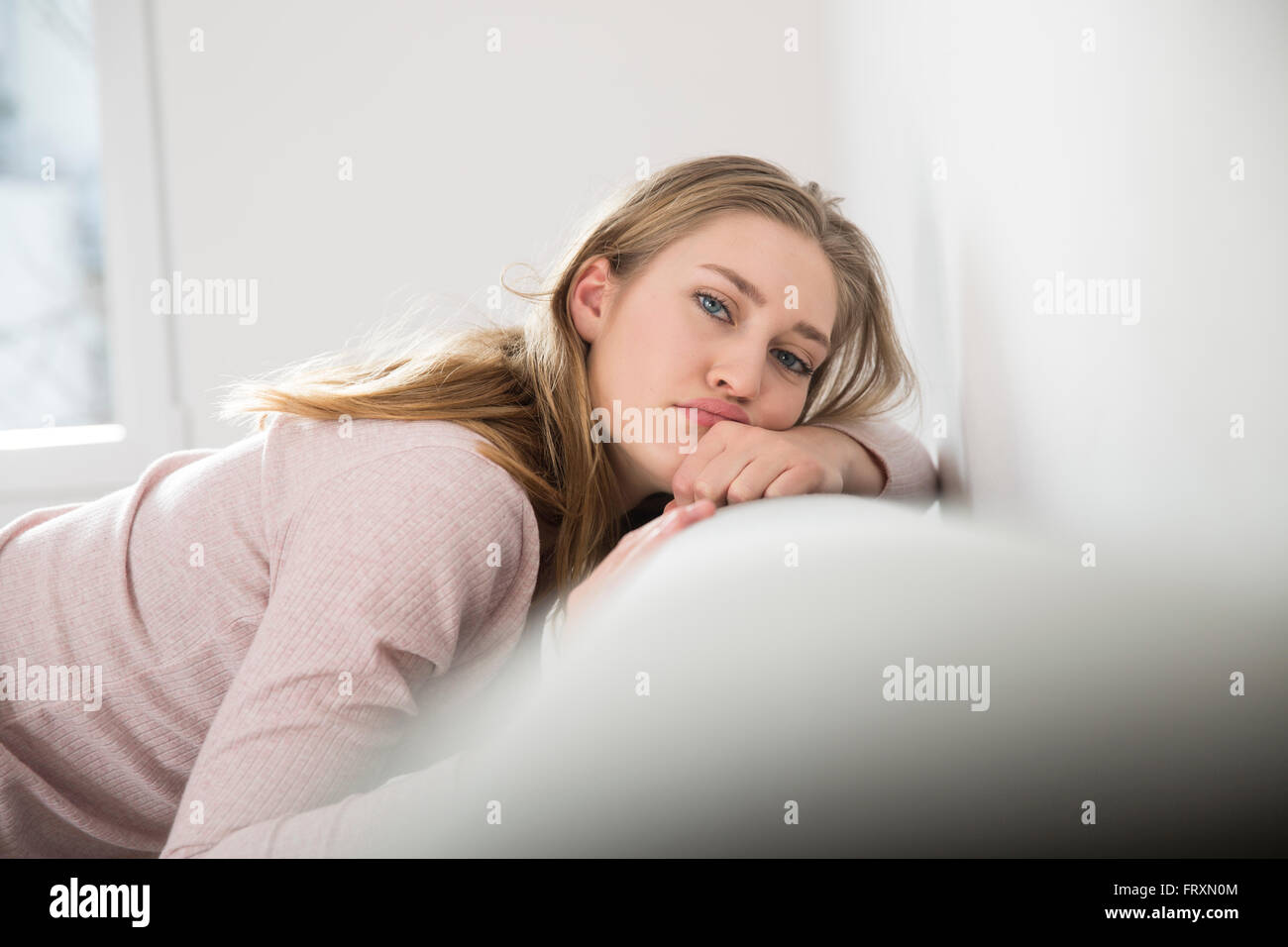 Portrait of young woman pouting mouth Stock Photo - Alamy