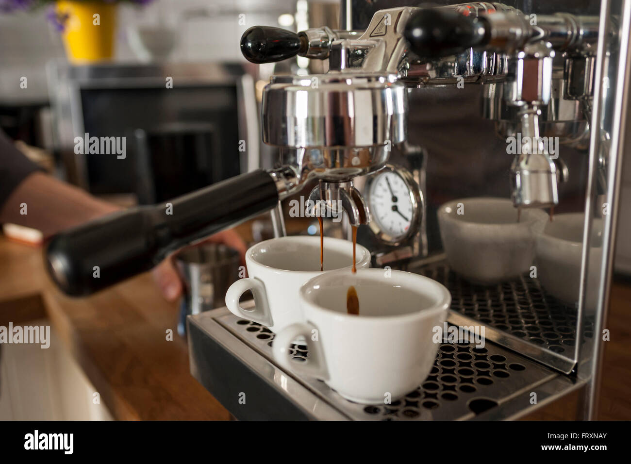 Portafilter machine, two cups of cappuccino Stock Photo - Alamy