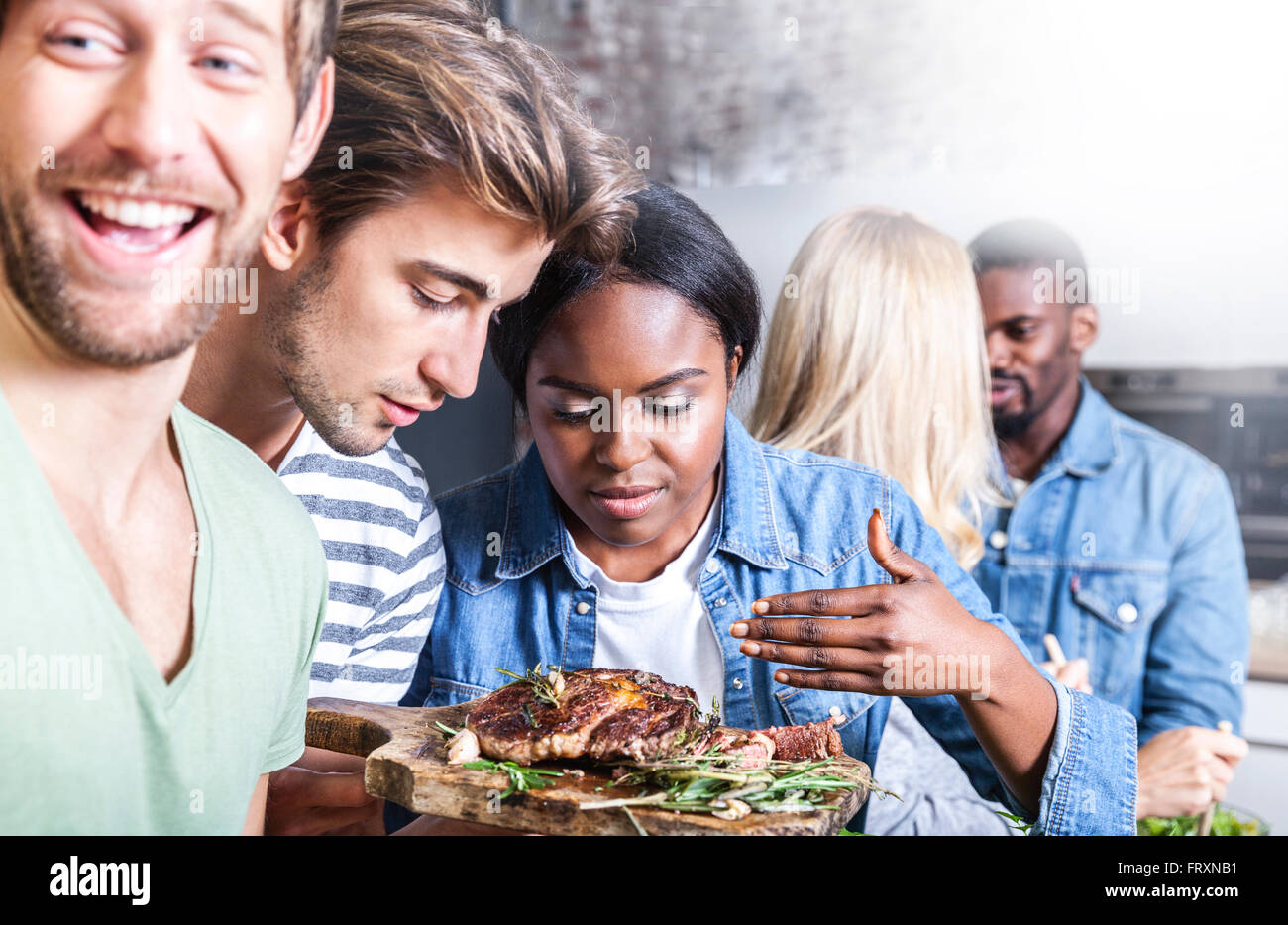 Friends cooking together Stock Photo - Alamy