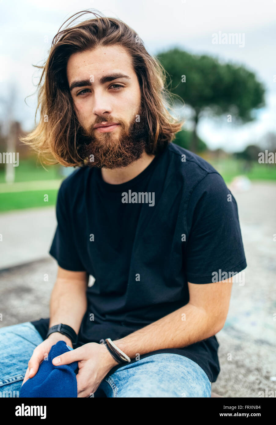 Portrait of bearded young man Stock Photo - Alamy