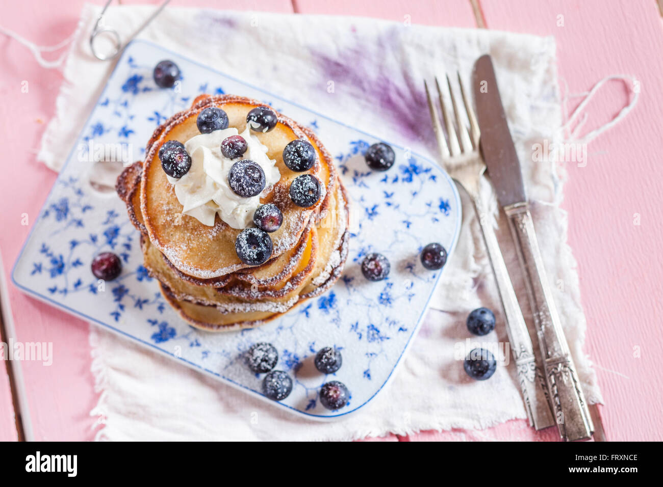 Stack of American pancakes with whipped cream and blueberries Stock ...
