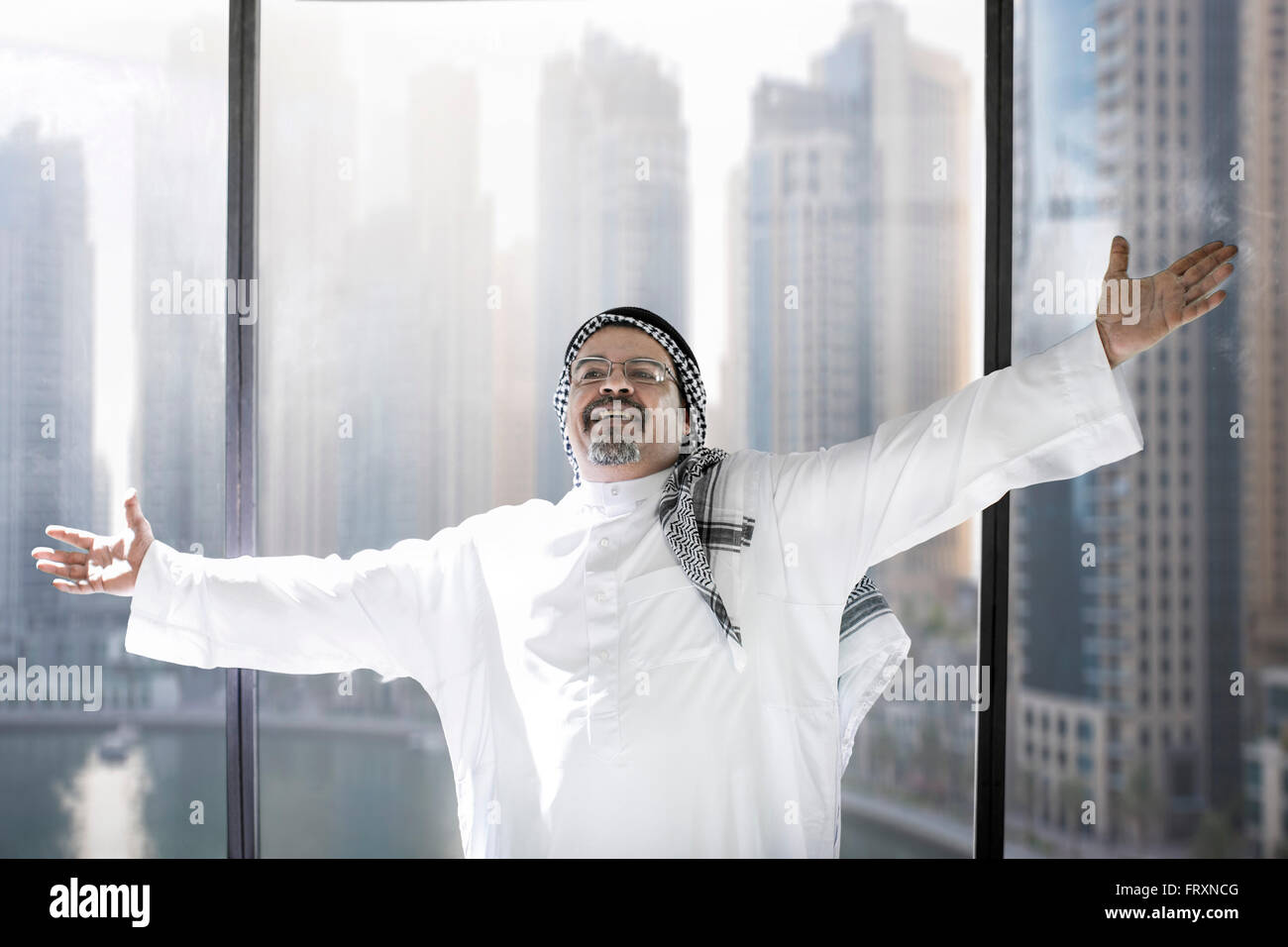 Middle Eastern businessman in office with open arms Stock Photo - Alamy