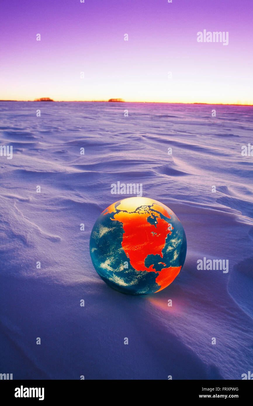 Earth Globe Laying on a Snowy Landscape Stock Photo - Alamy