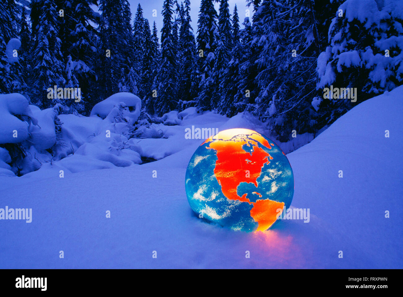Earth Globe in Snow among Snow-Covered Trees Stock Photo - Alamy