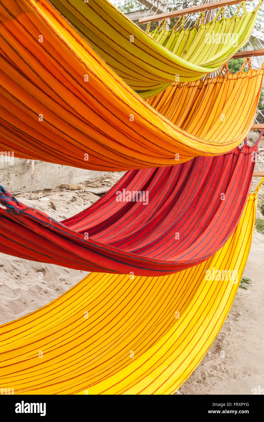 Multi-color hammocks in little village market place in Ecuador Stock ...
