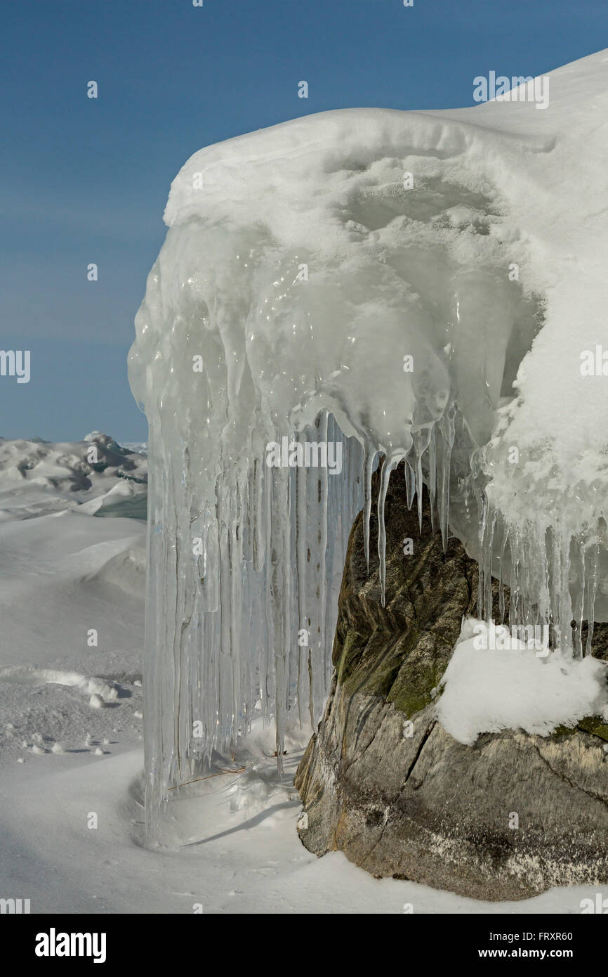 Beautiful icicles on rocks Stock Photo - Alamy