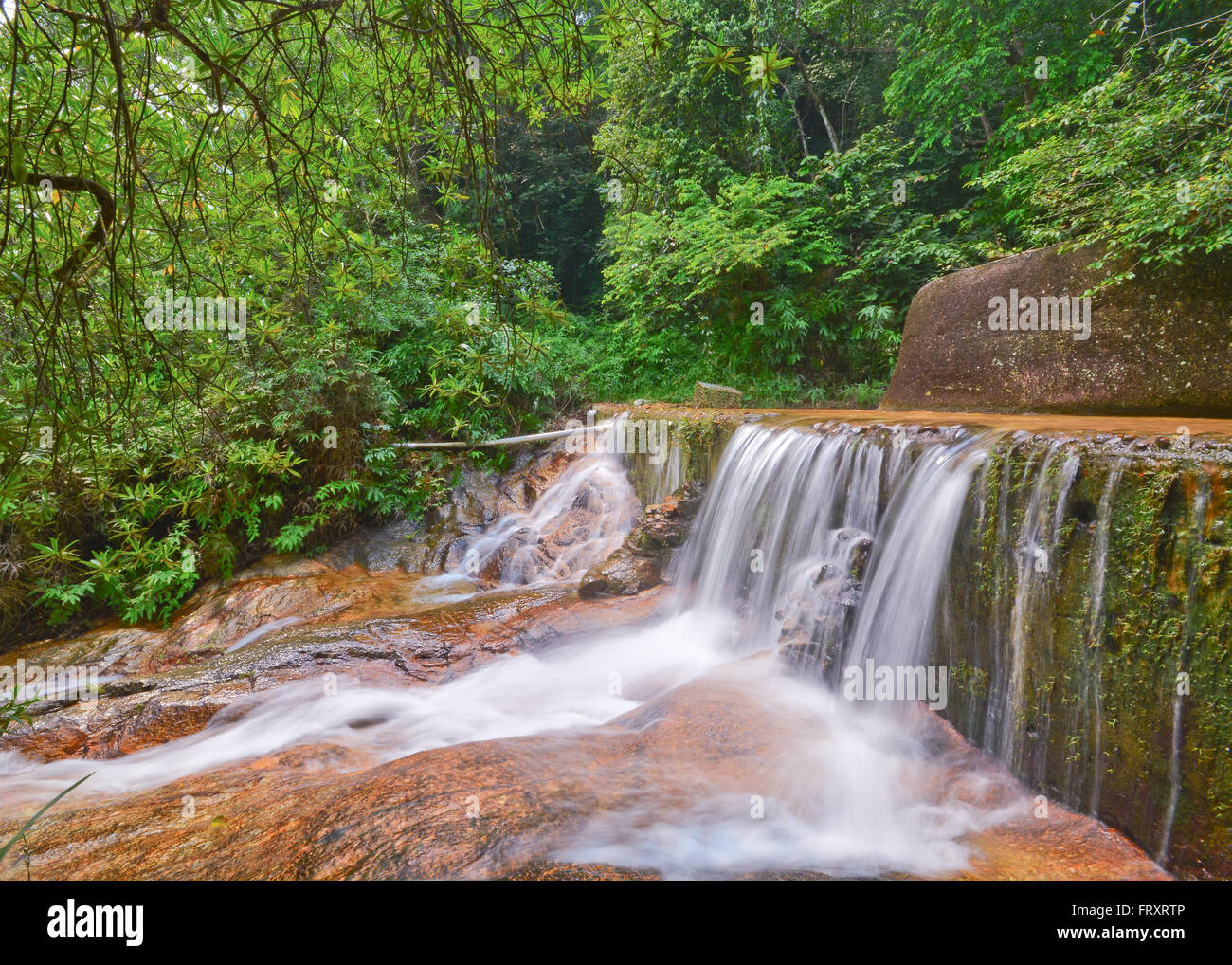 Beautiful water stream in tropical rain forest located at Malaysia ...