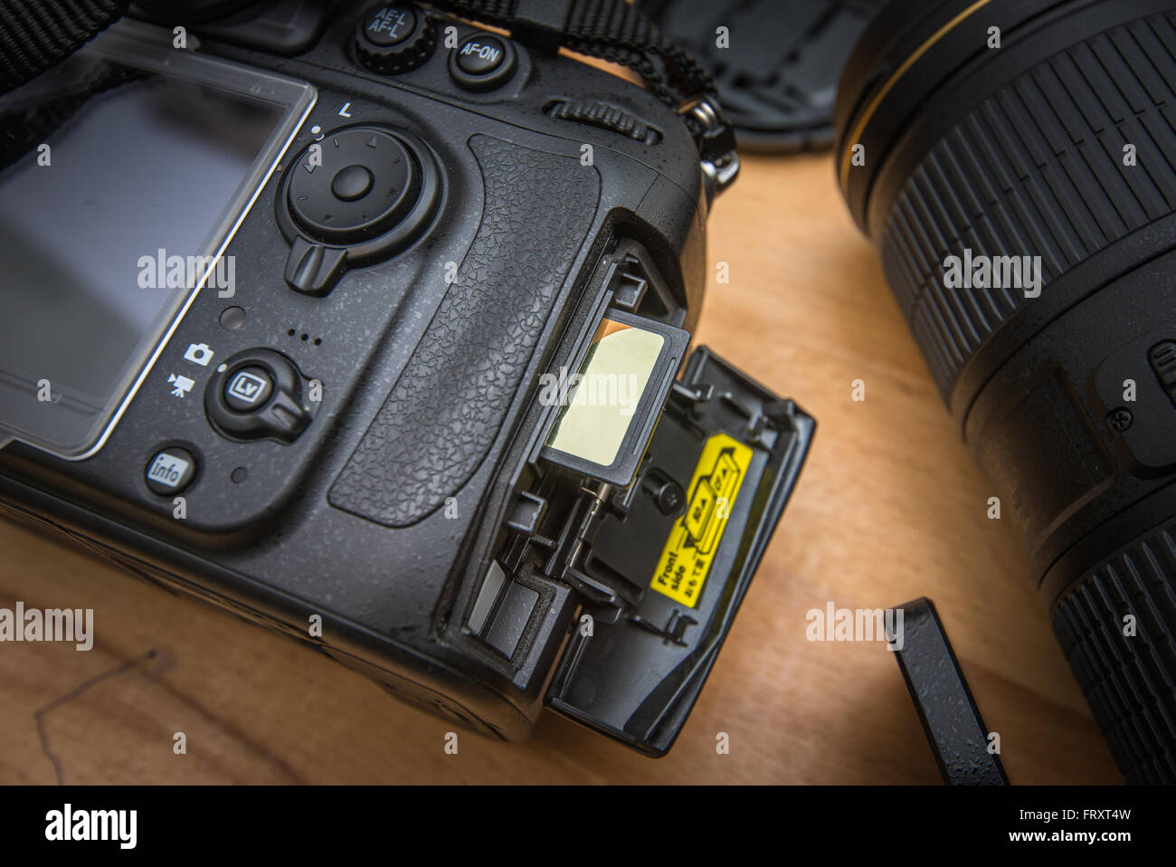 Close up modern DSLR camera and SD memory card Stock Photo - Alamy