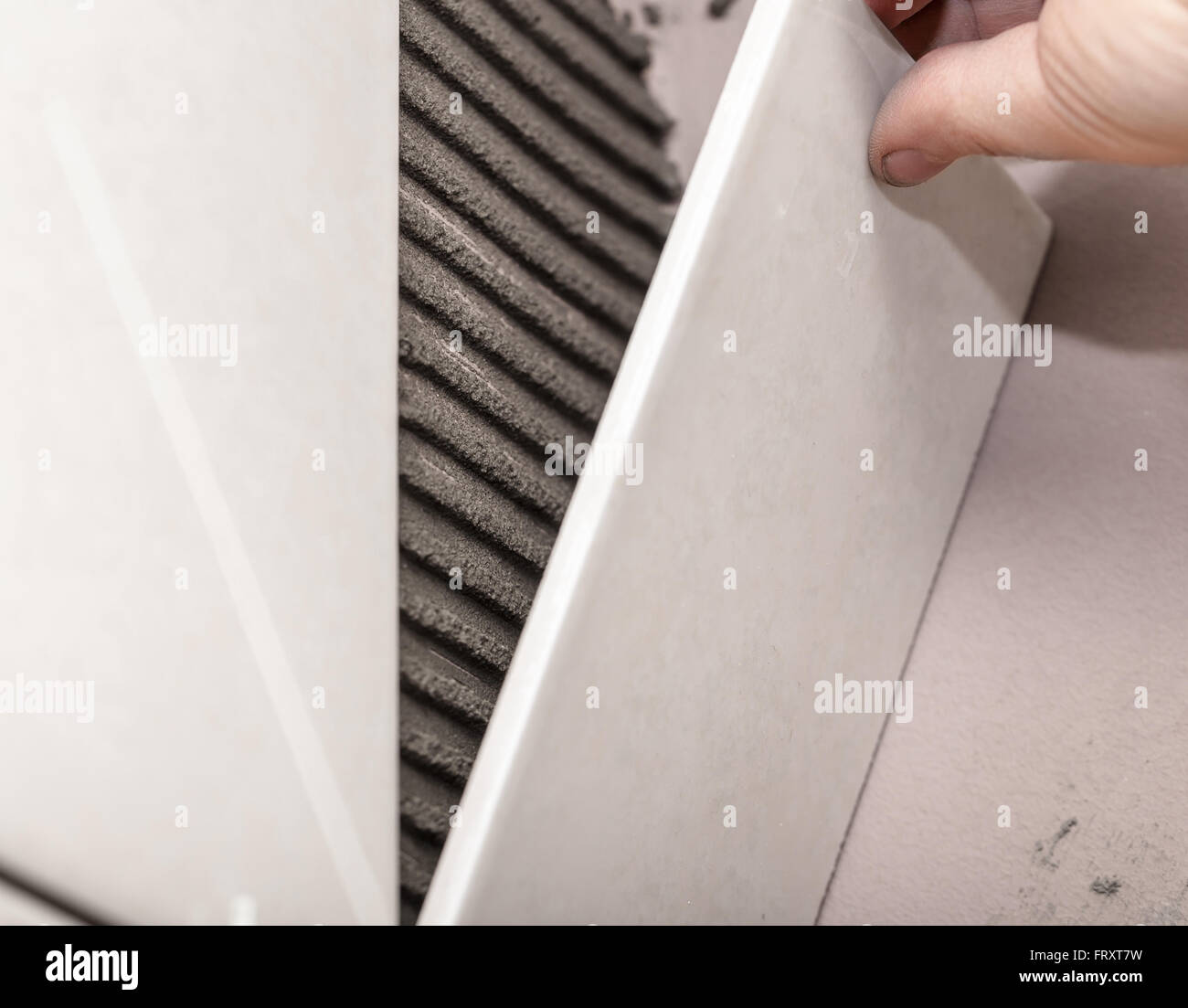 Tiler work laying ceramic tiles hi-res stock photography and images - Alamy