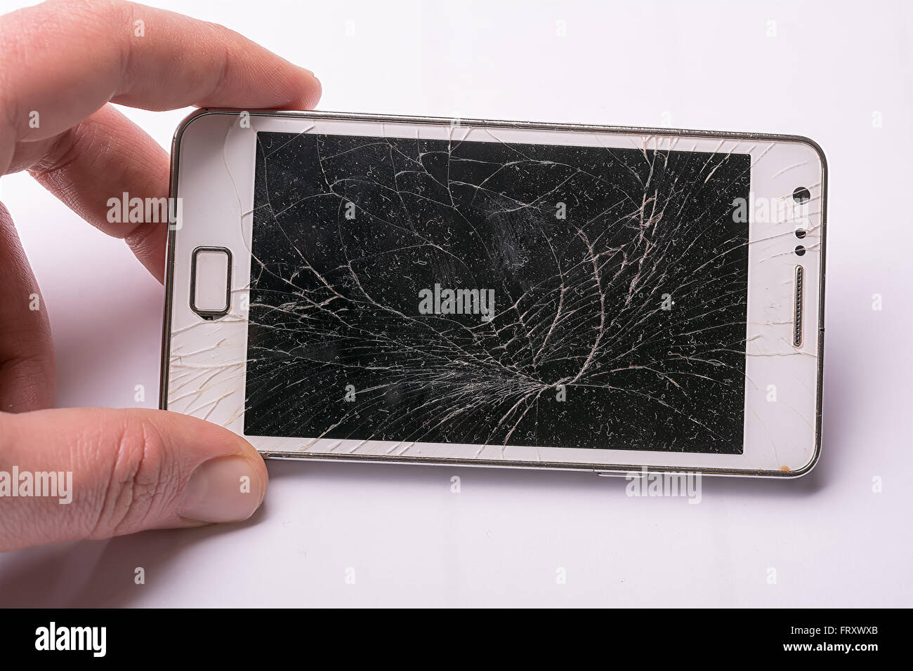 Smartphone drop to the floor and screen damage broken on white ...