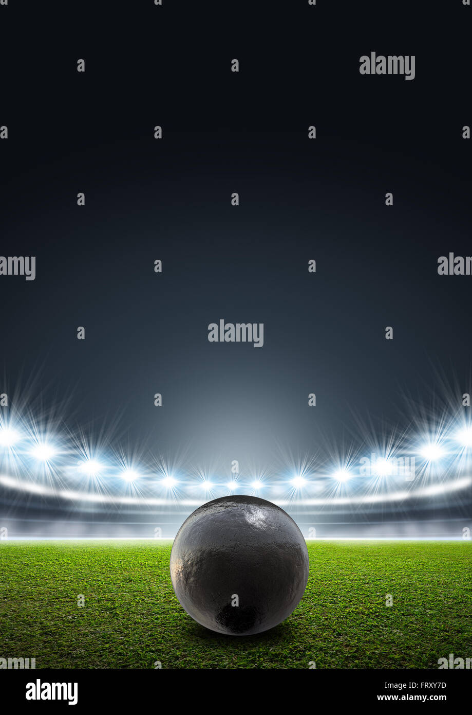 A shot put ball in a generic stadium resting on an unmarked green grass ...