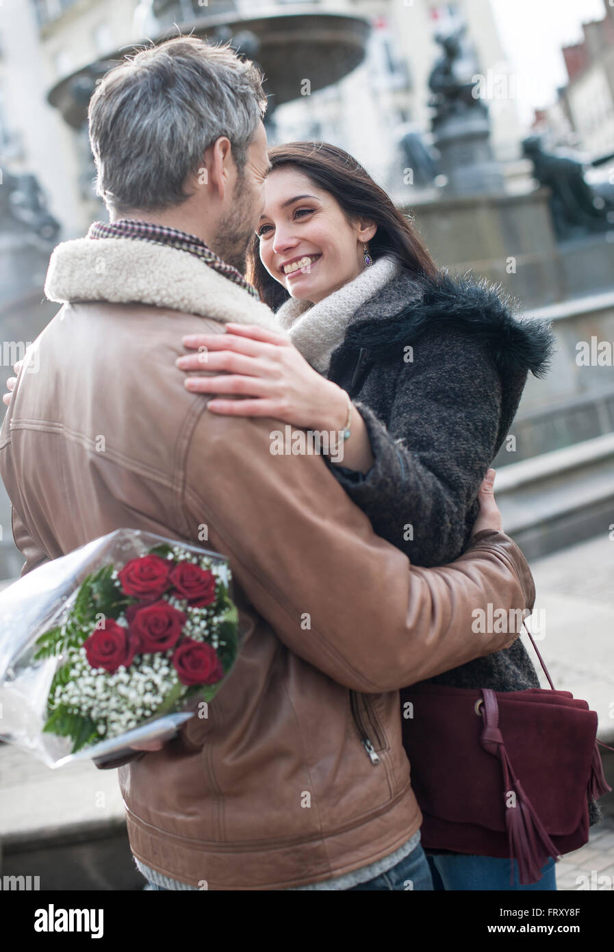 Guy holding red rose behind hi-res stock photography and images - Alamy