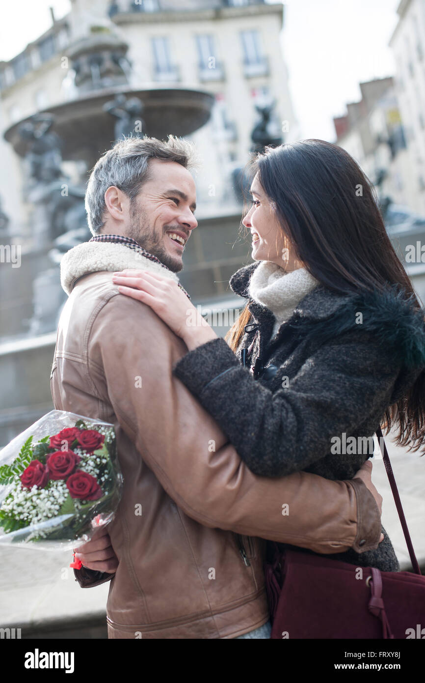 Guy holding red rose behind hi-res stock photography and images - Alamy