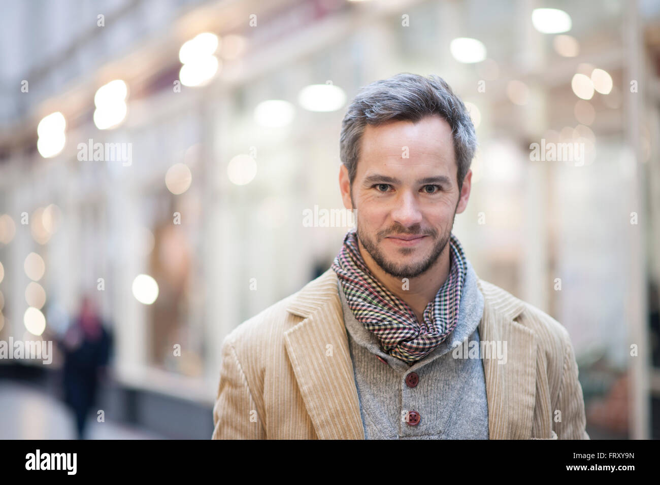 portrait of handsome man city lights in the background Stock Photo - Alamy