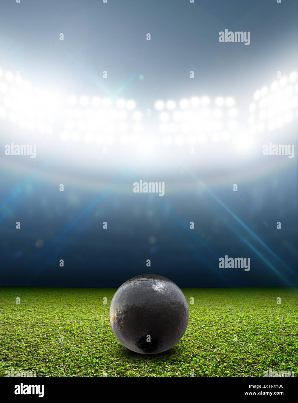A shot put ball in a generic stadium resting on an unmarked green grass ...