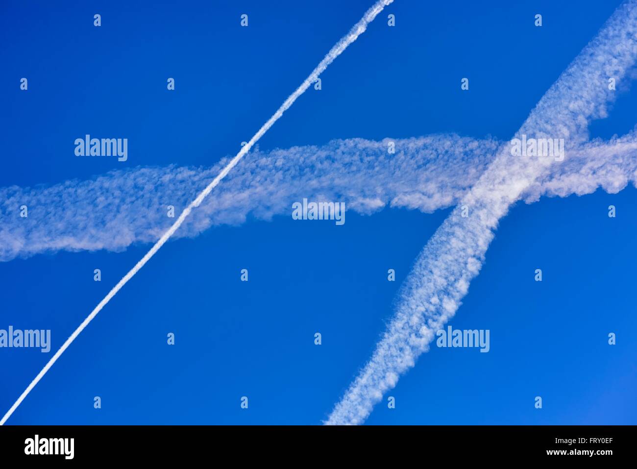 Contrails of jet aircrafts in the blue sky, Germany Stock Photo - Alamy