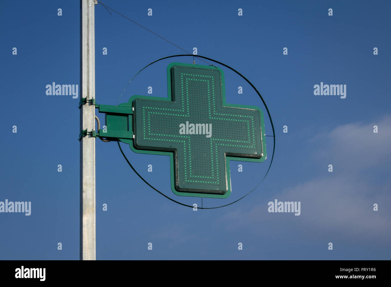 Pharmacy cross sign in the city with blue sky, sunshining Stock Photo ...