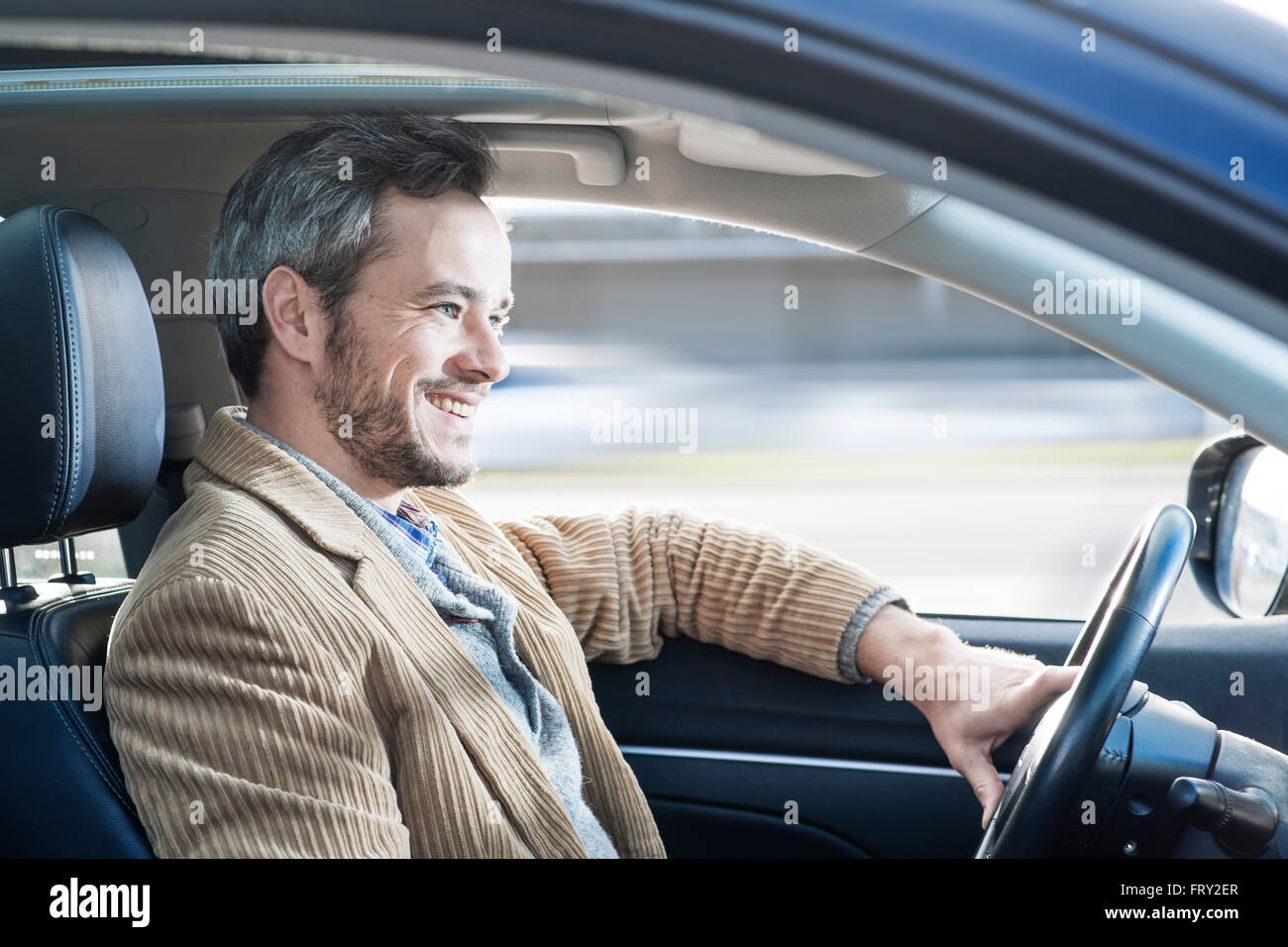 handsome man driving a car Stock Photo - Alamy