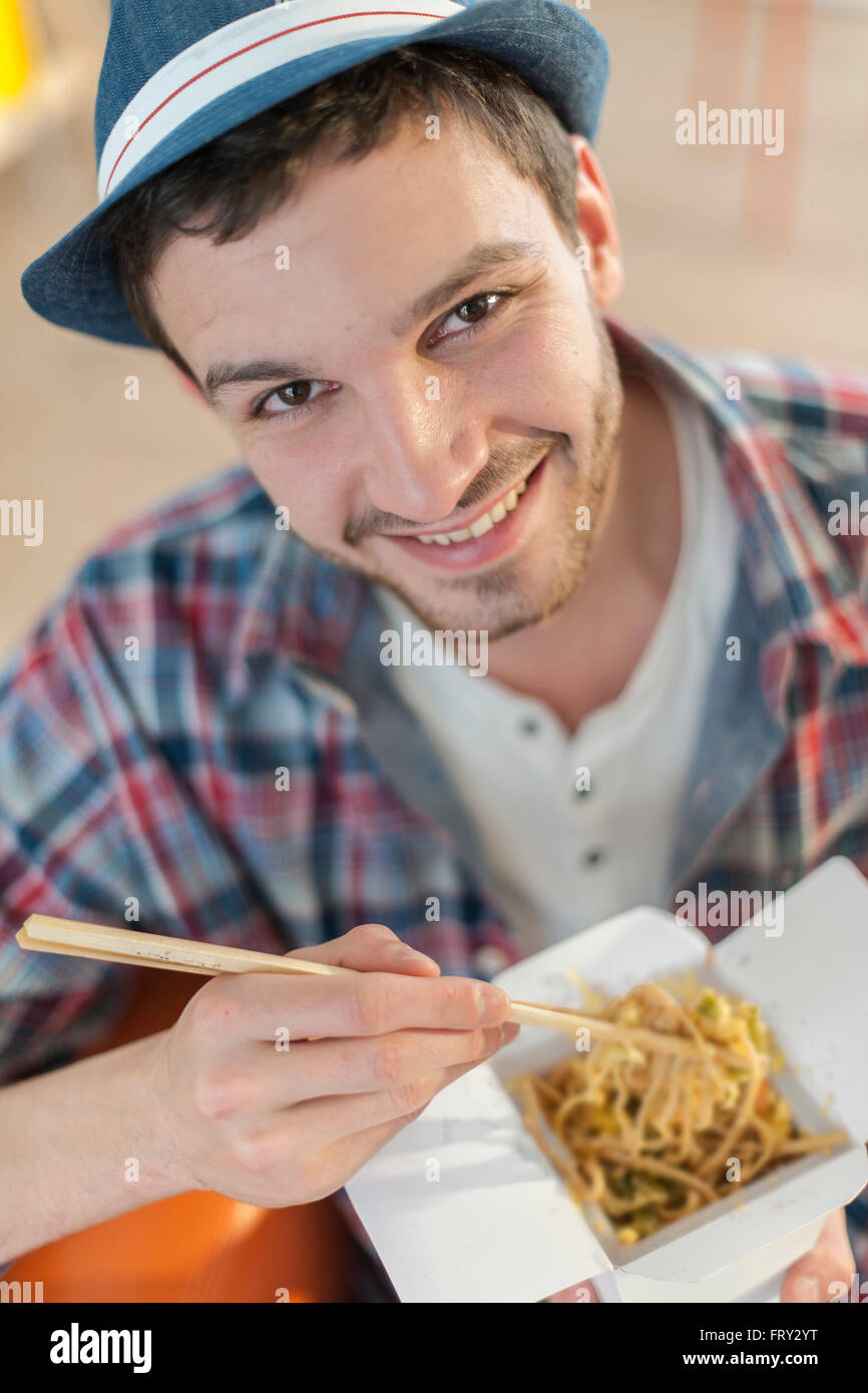 Hat man eating noodles hi-res stock photography and images - Alamy