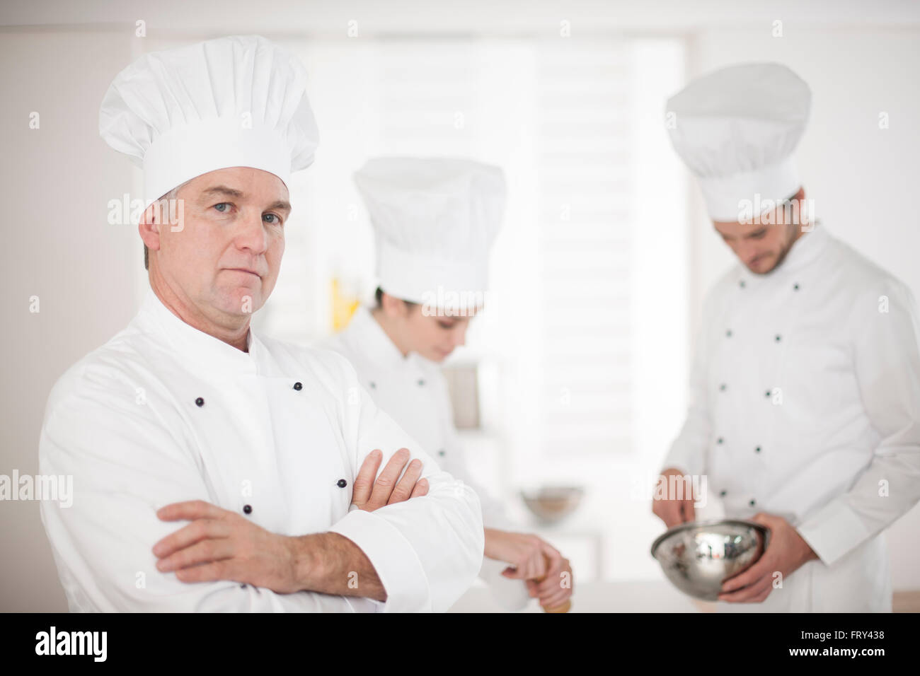 portrait of a chef and his kitchen team Stock Photo - Alamy