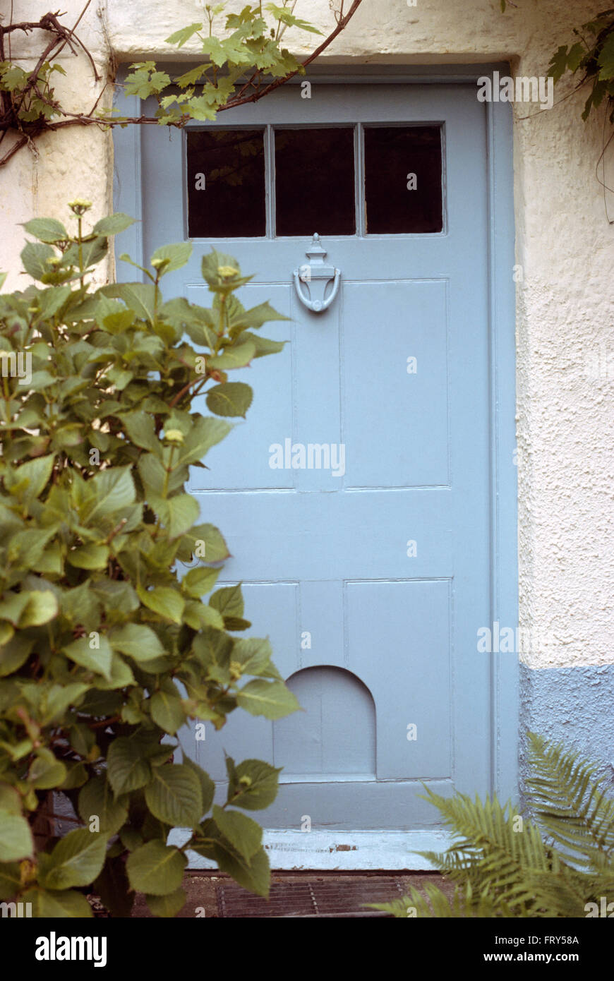 Close-up of a pale blue cottage door Stock Photo - Alamy