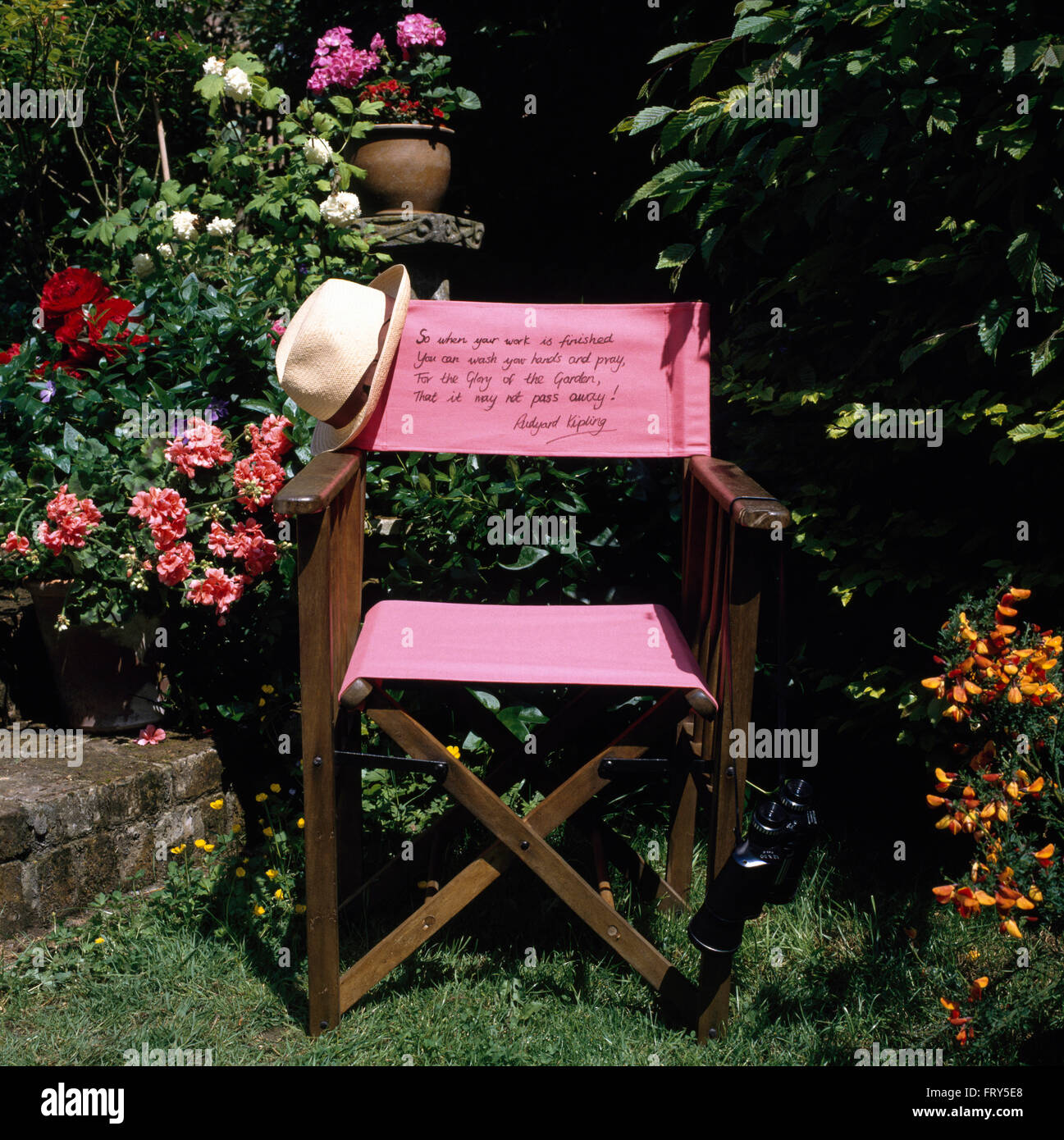 Lettering on pink canvas director's chair with calligraphy with a straw ...
