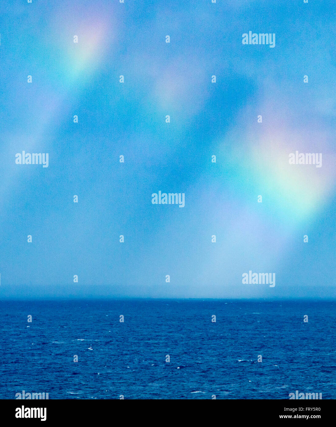 Rainbow over the sea, ocean Stock Photo - Alamy