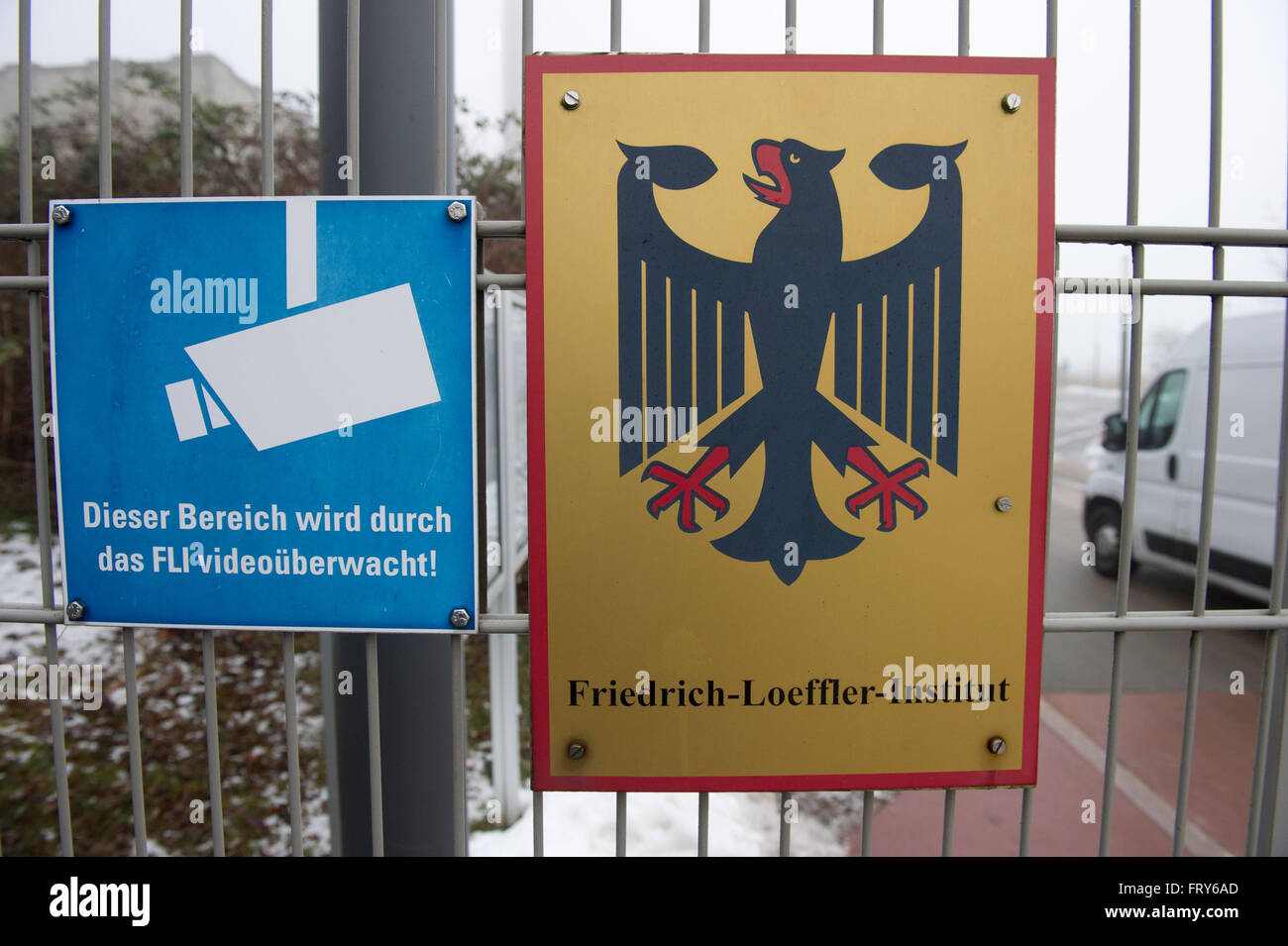 A sign with the German federal eagle hangs in the entryway of the ...