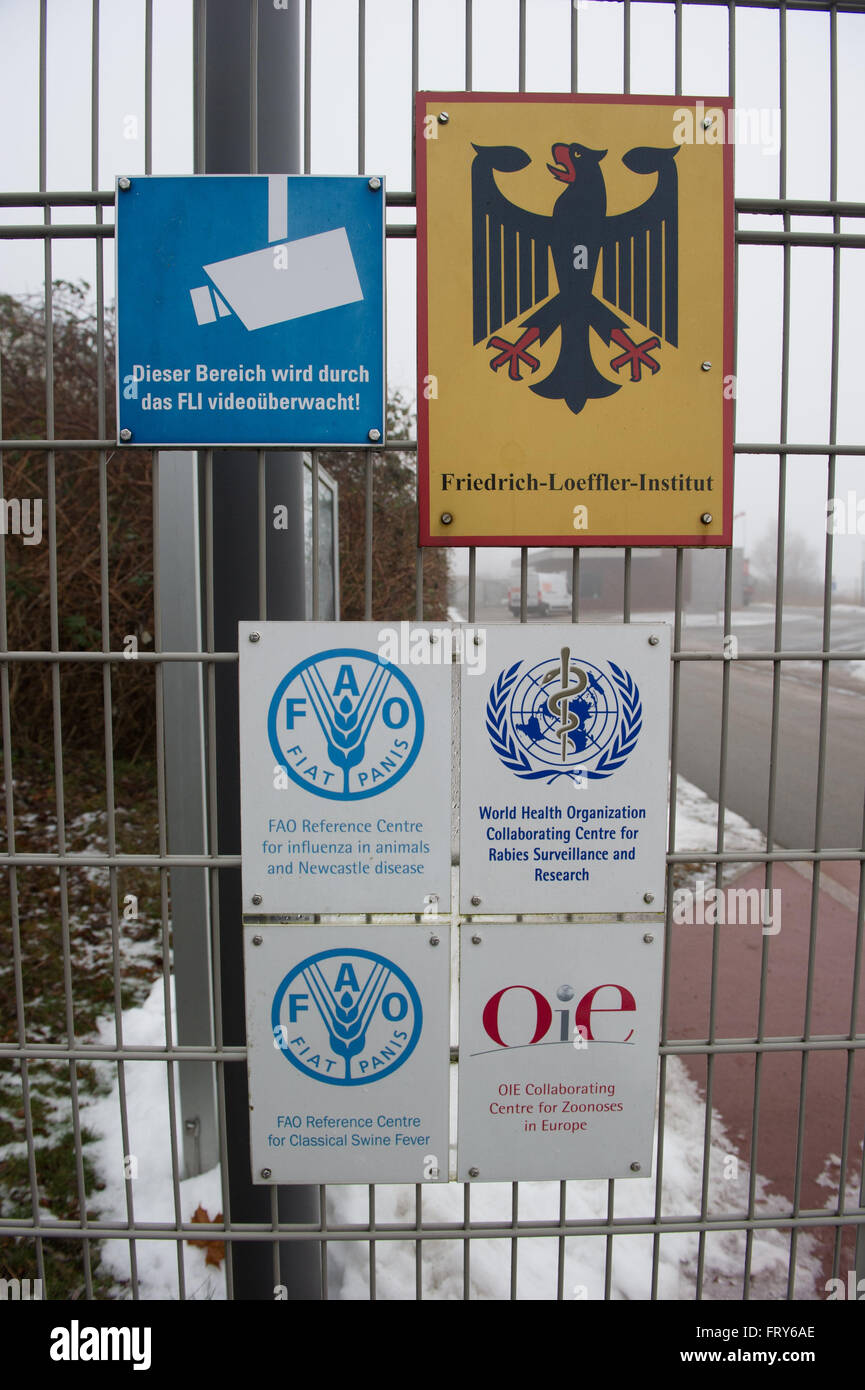 A sign with the German federal eagle hangs in the entryway of the ...