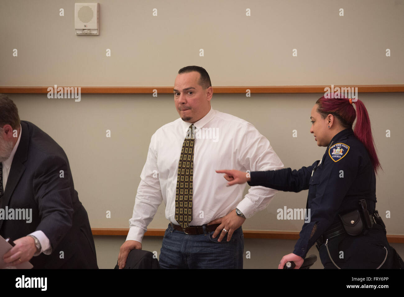 New York, NY, USA. 23rd Mar, 2016. A court officer gestures to Rikers ...