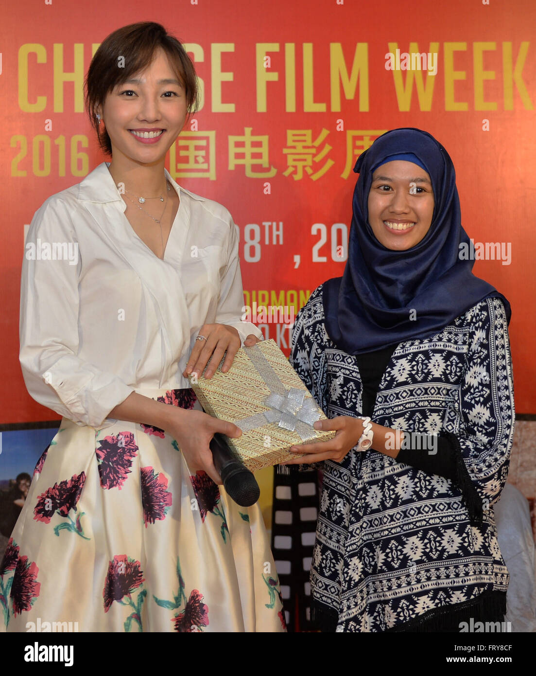 Jakarta, Indonesia. 24th Mar, 2016. Chinese actress Bai Baihe (L) poses ...