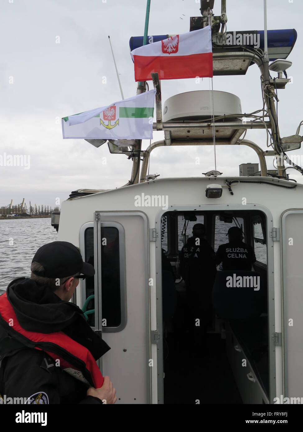 A member of the Polish customs department for crime prevention at sea ...