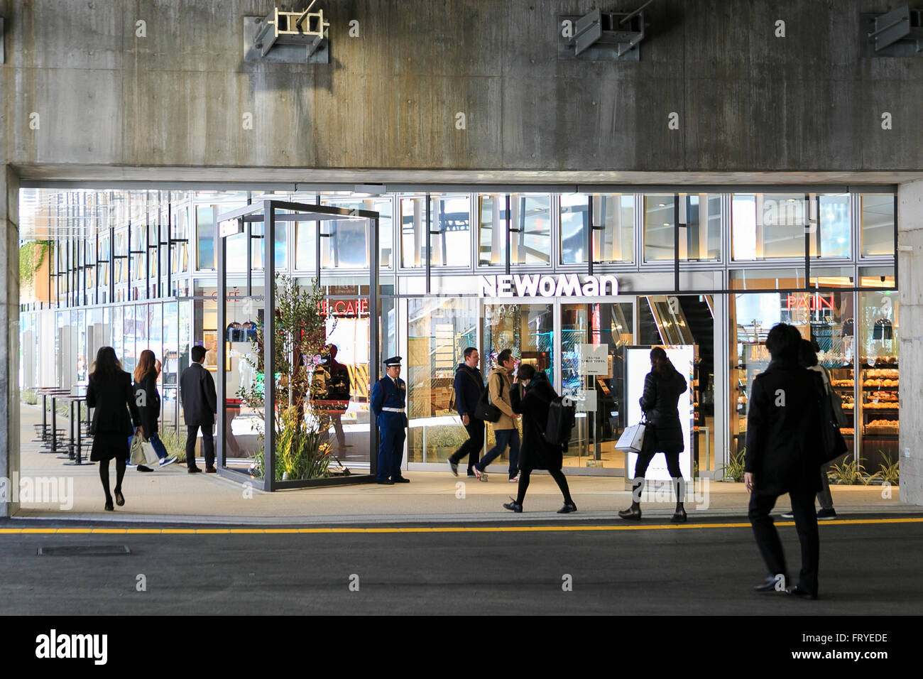 Pedestrians walk past the new department store NEWoMan in Shinjuku ...