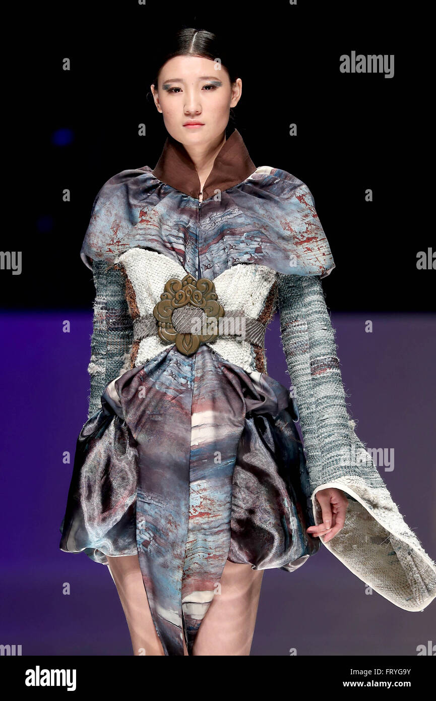 Beijing, China. 25th Mar, 2016. A model presents a creation of the 24th ...