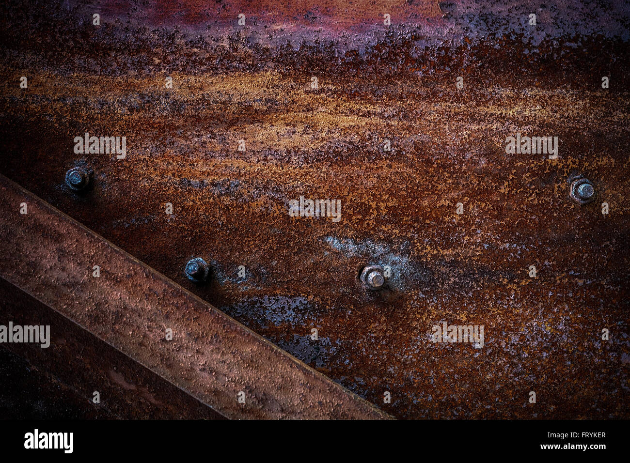 Rusty metal plate texture with bolts. Industrial background Stock Photo ...