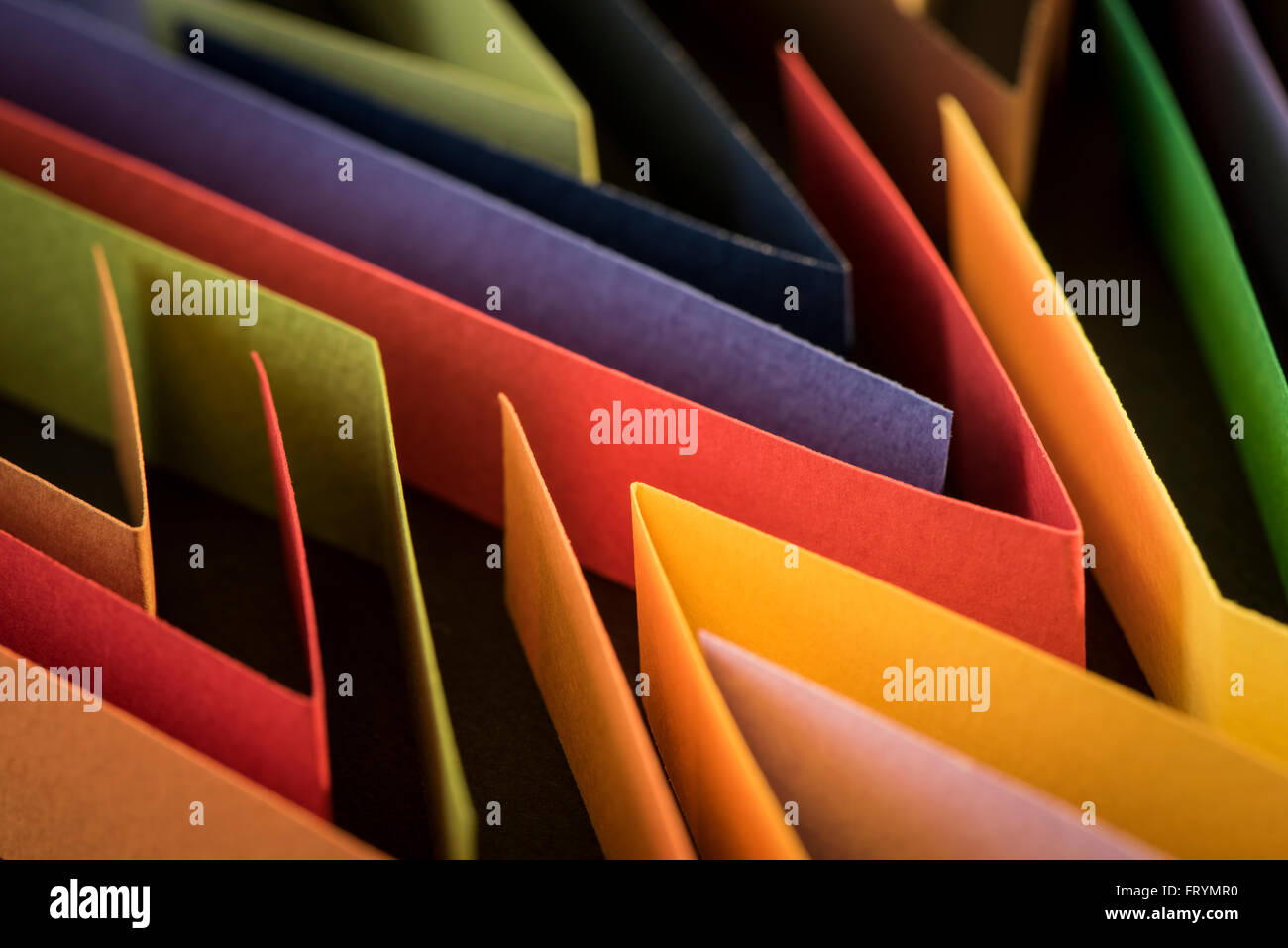 Colourful strips of cardboard as texture and background on black ...