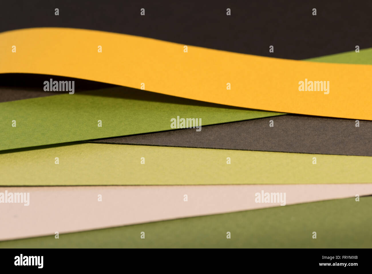 Colourful strips of cardboard as texture and background on black ...